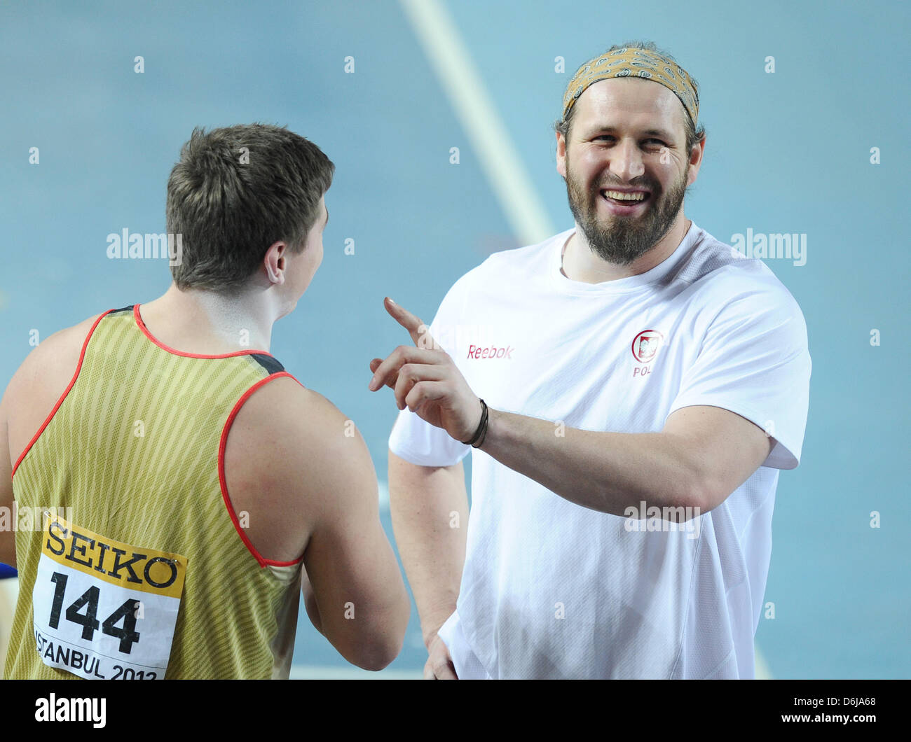 Germanys David Storl congratulates Tomasz Majewski (R) of Poland after ...