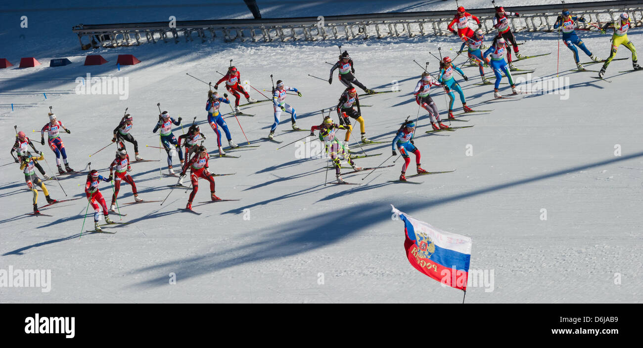 The starter biathletes begin the women's relay 4 x 6 km event during ...