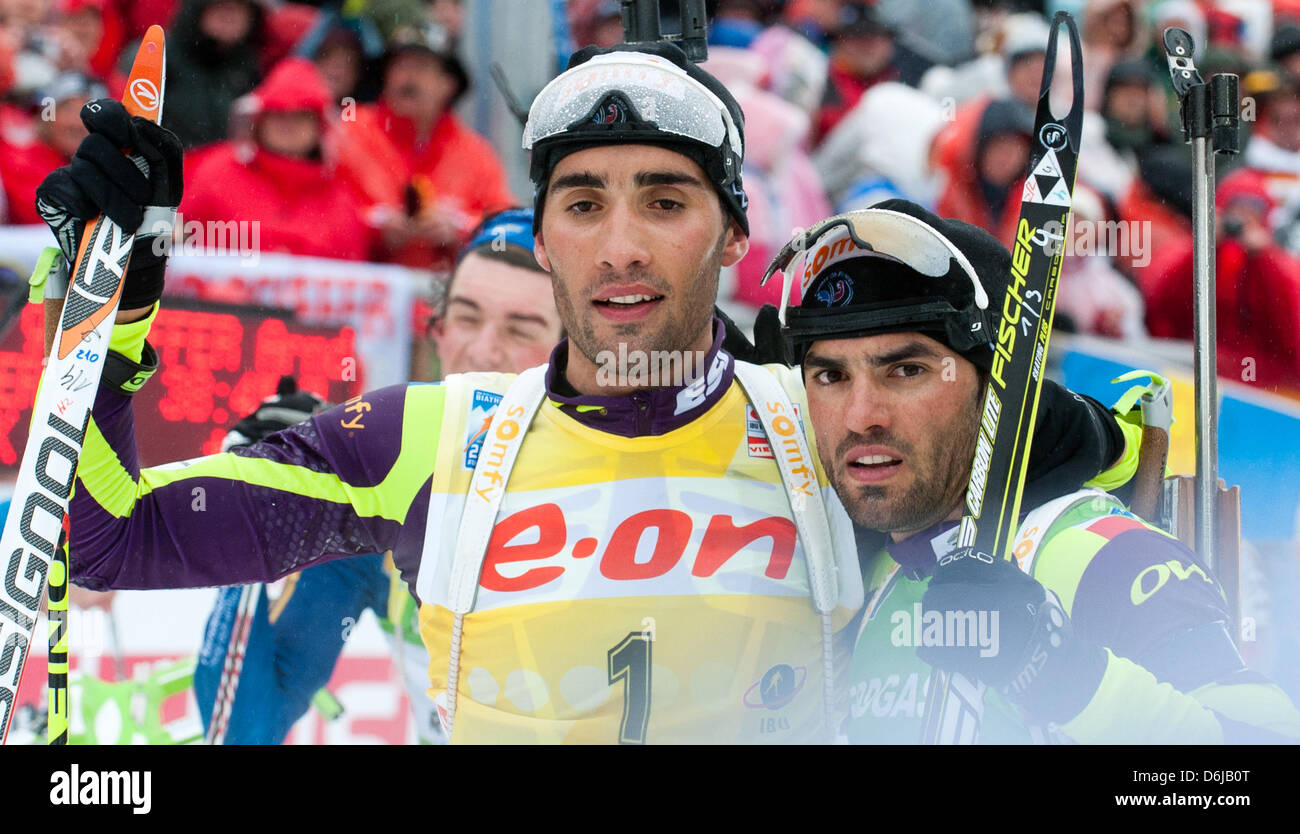 French biathlete Martin Fourcade (L) hugs his brother Simon Fourcade ...
