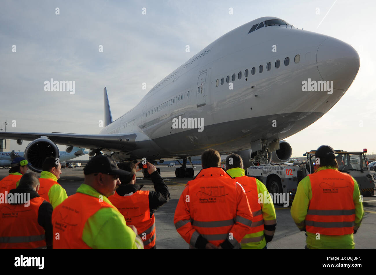 A Boeing 747-8 Intercontinental aircraft rolls to a gate at the airport ...