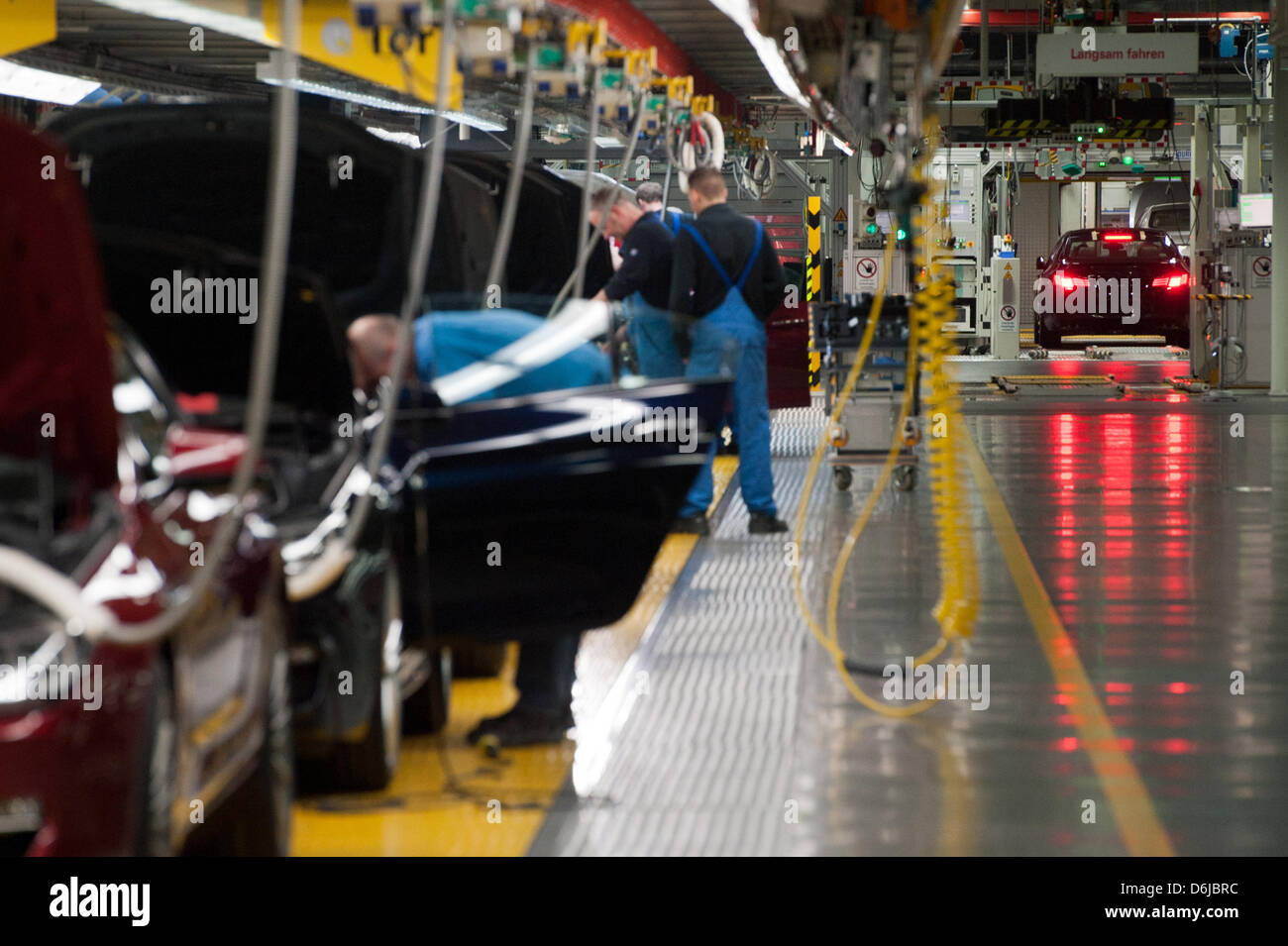 BMW employees work on a BMW 6 inside the company's plant in Dingolfing ...