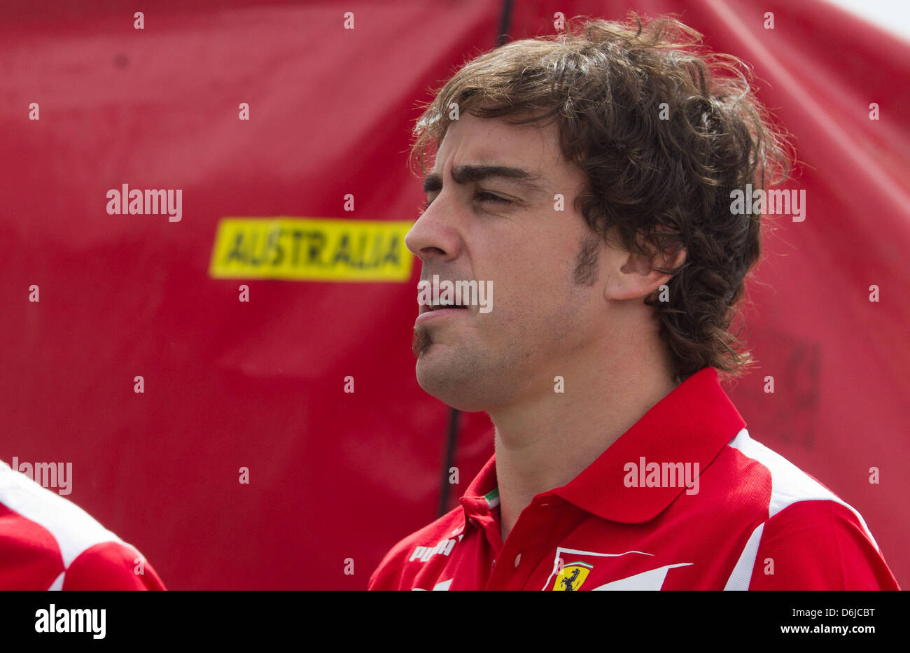 Spanish Formula One driver Fernando Alonso of Ferrari walks through the ...