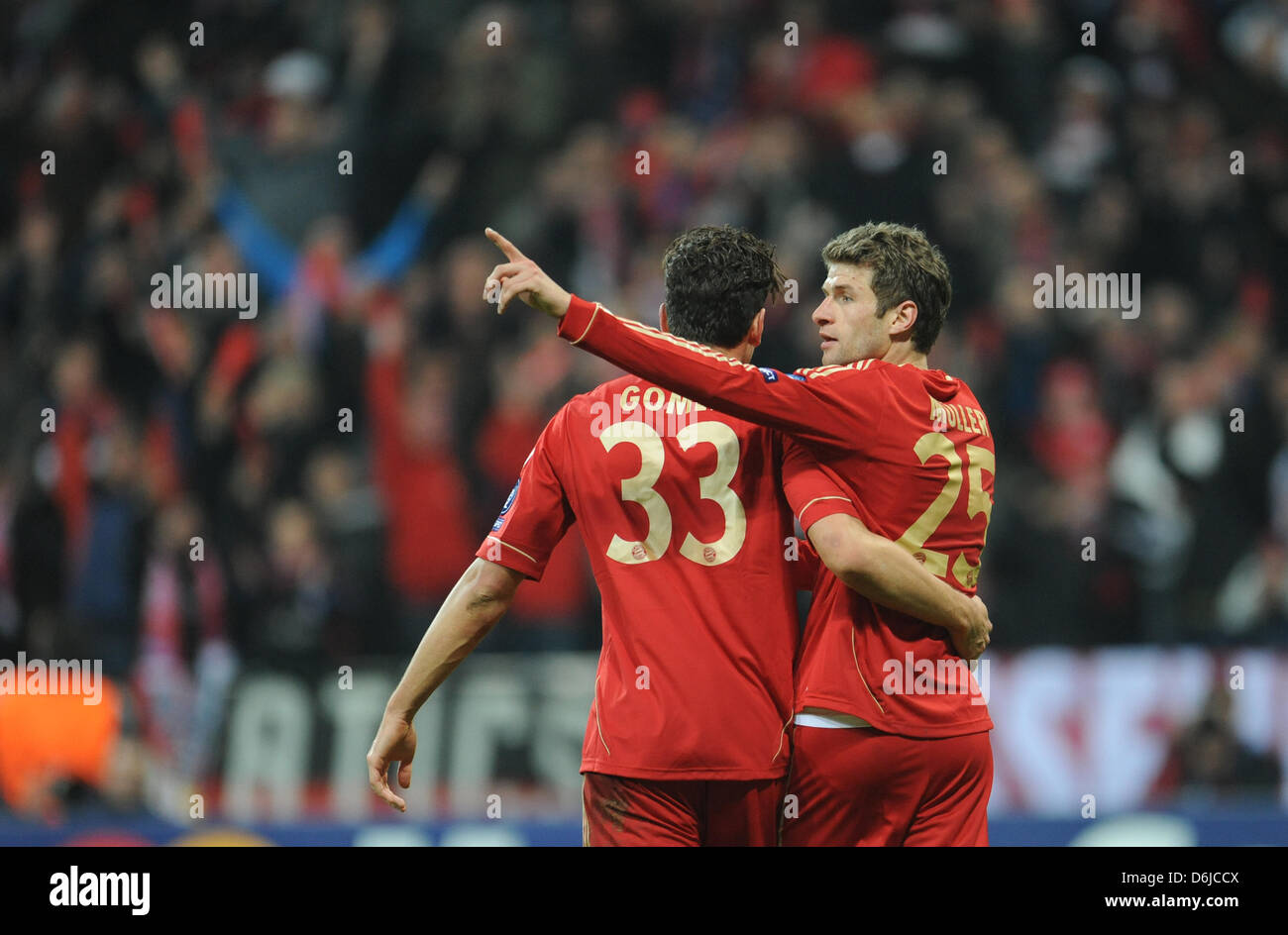 Munich's Mario Gomez (L) and Thomas Mueller hug during the Champions ...
