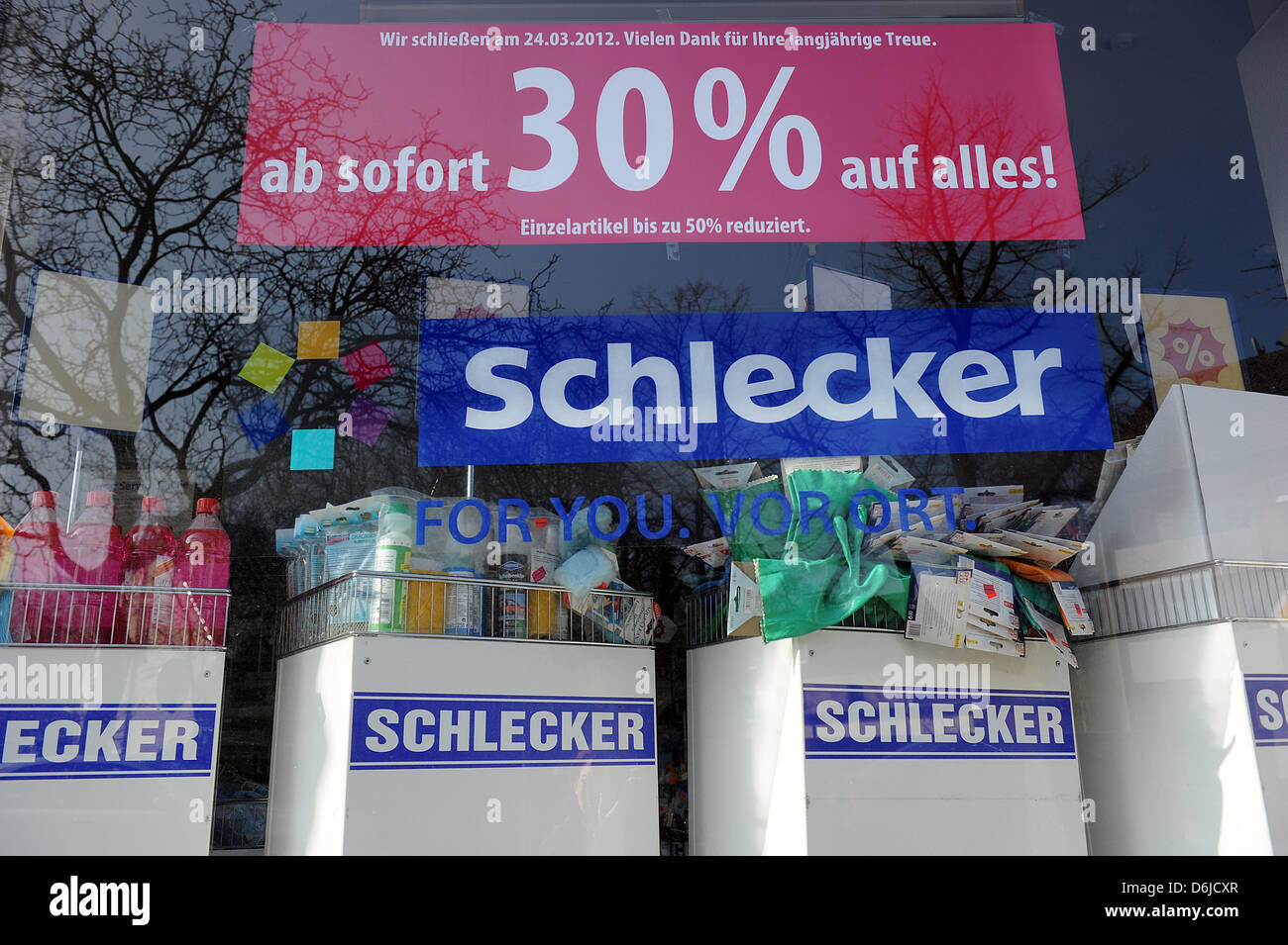 A dicount sign is fixed to a window of a store of the drug store chain ...