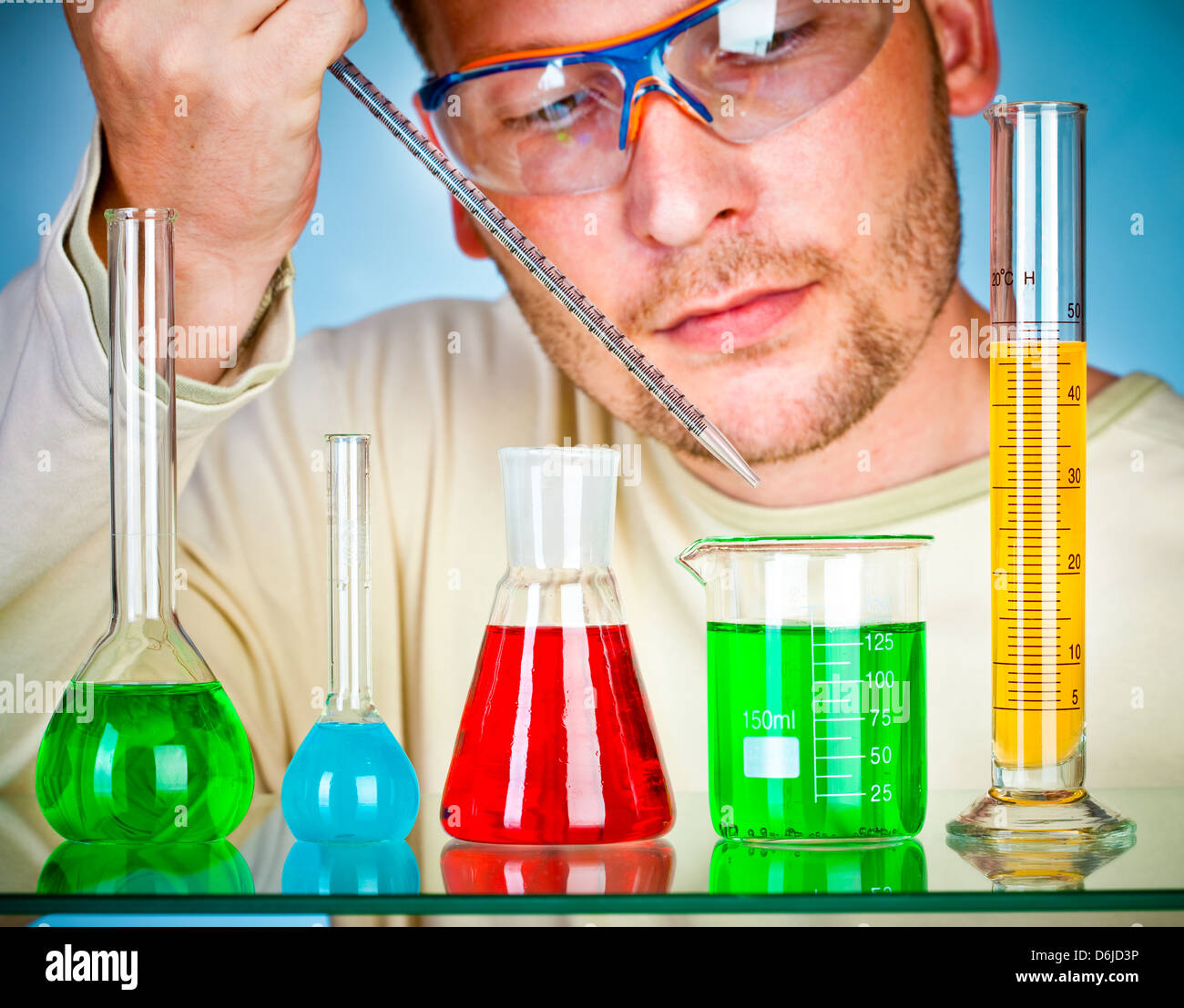 scientist in laboratory with test tubes Stock Photo - Alamy