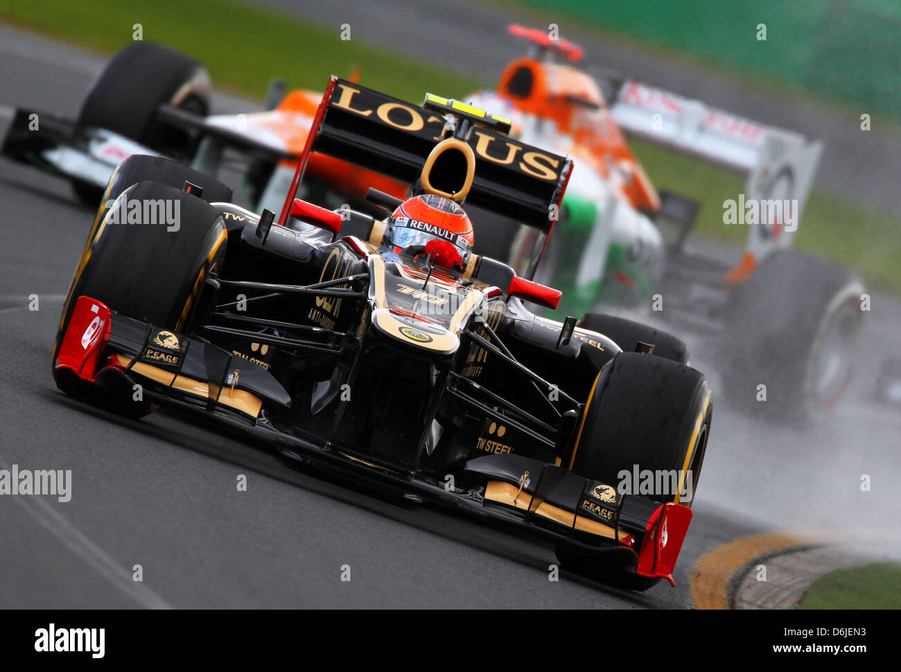 French Formula One driver Romain Grosjean of Lotus steers his car ...