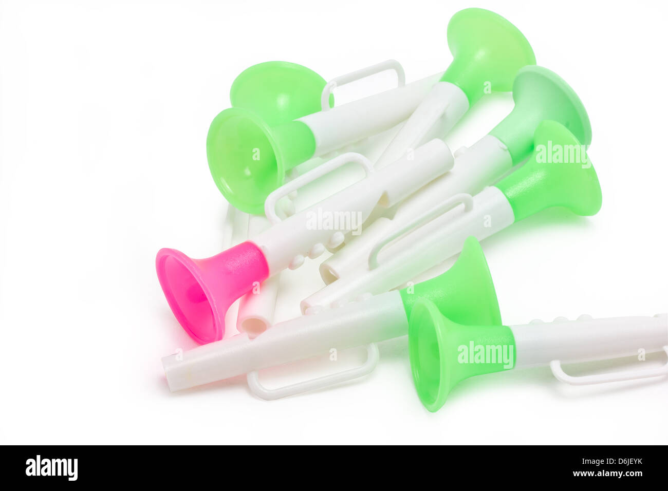 Children horn made of colored plastic isolated on white background ...