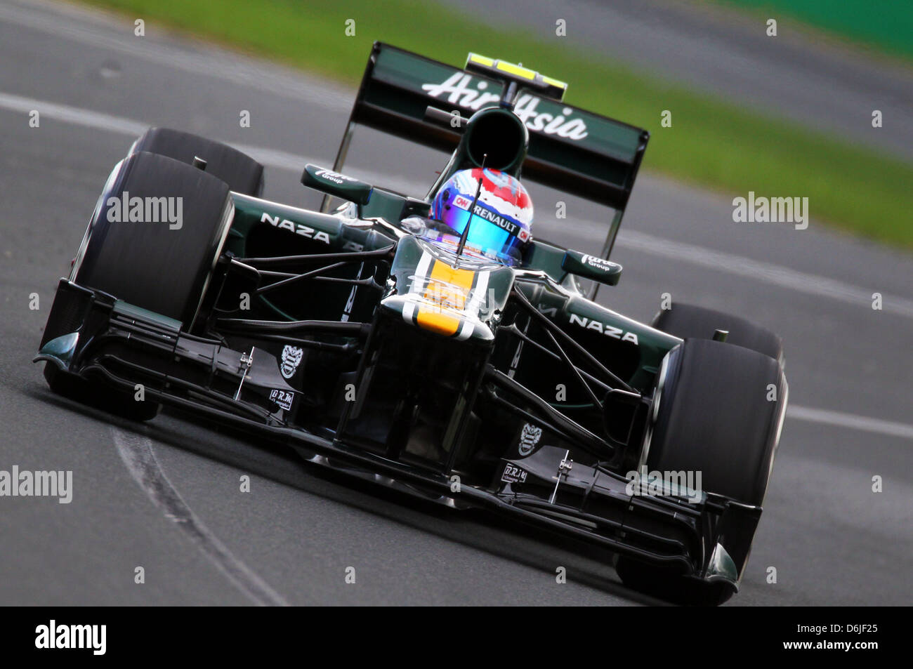 Russian Formula One driver Vitaly Petrov of Caterham steers his car ...