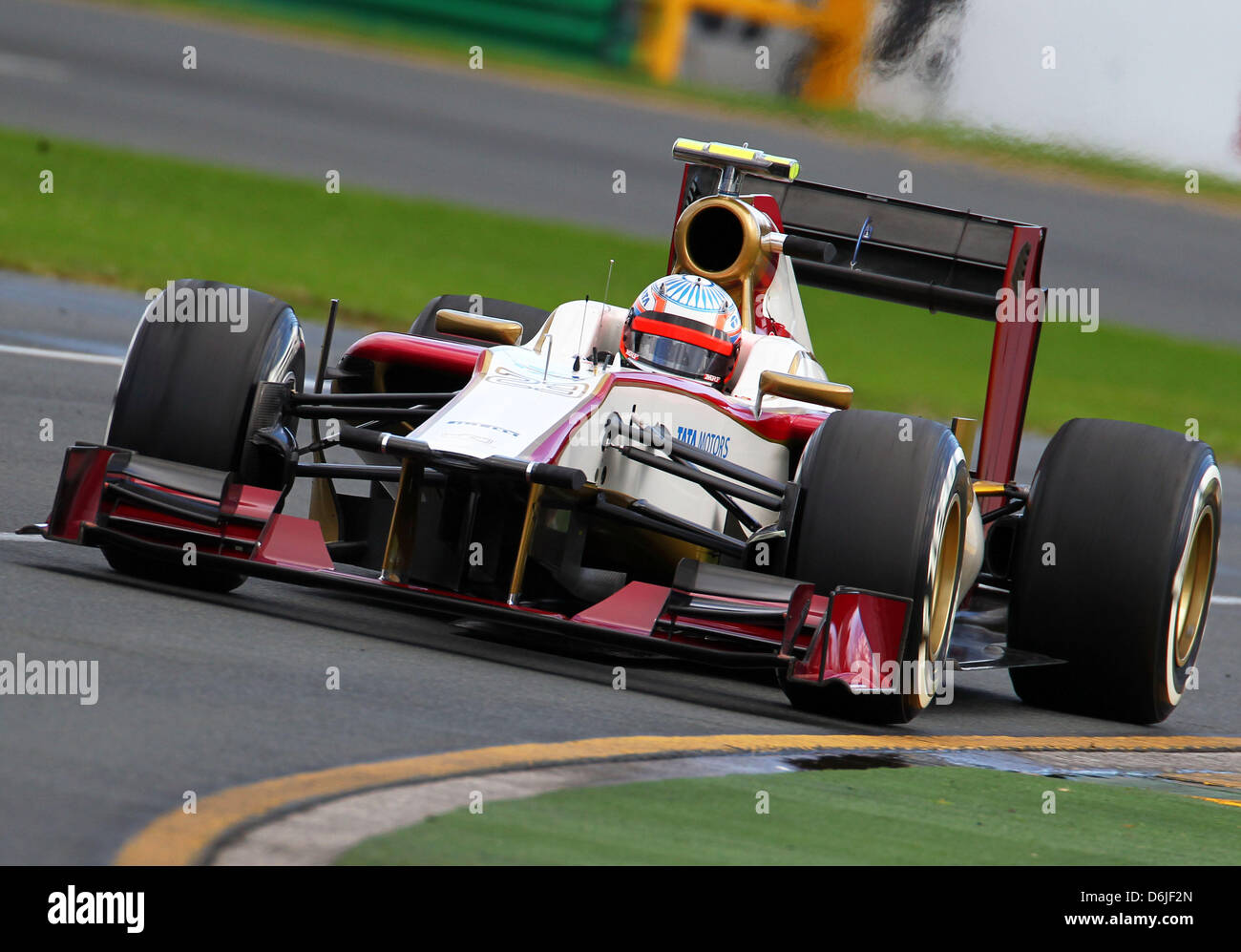 Indian Formula One driver Narain Karthikeyan of HRT steers his car ...