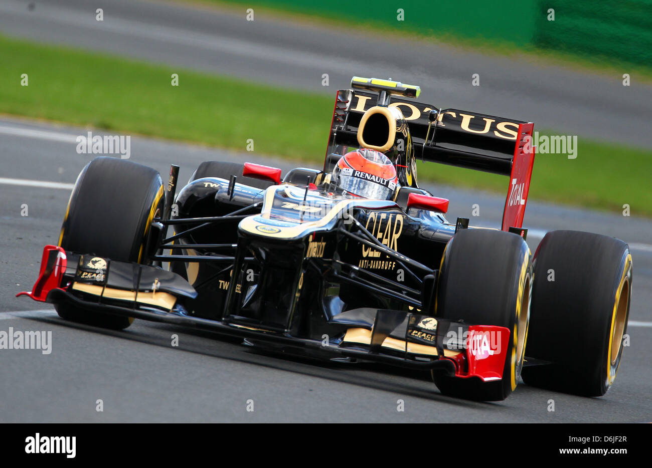 French Formula One driver Romain Grosjean of Lotus steers his car ...