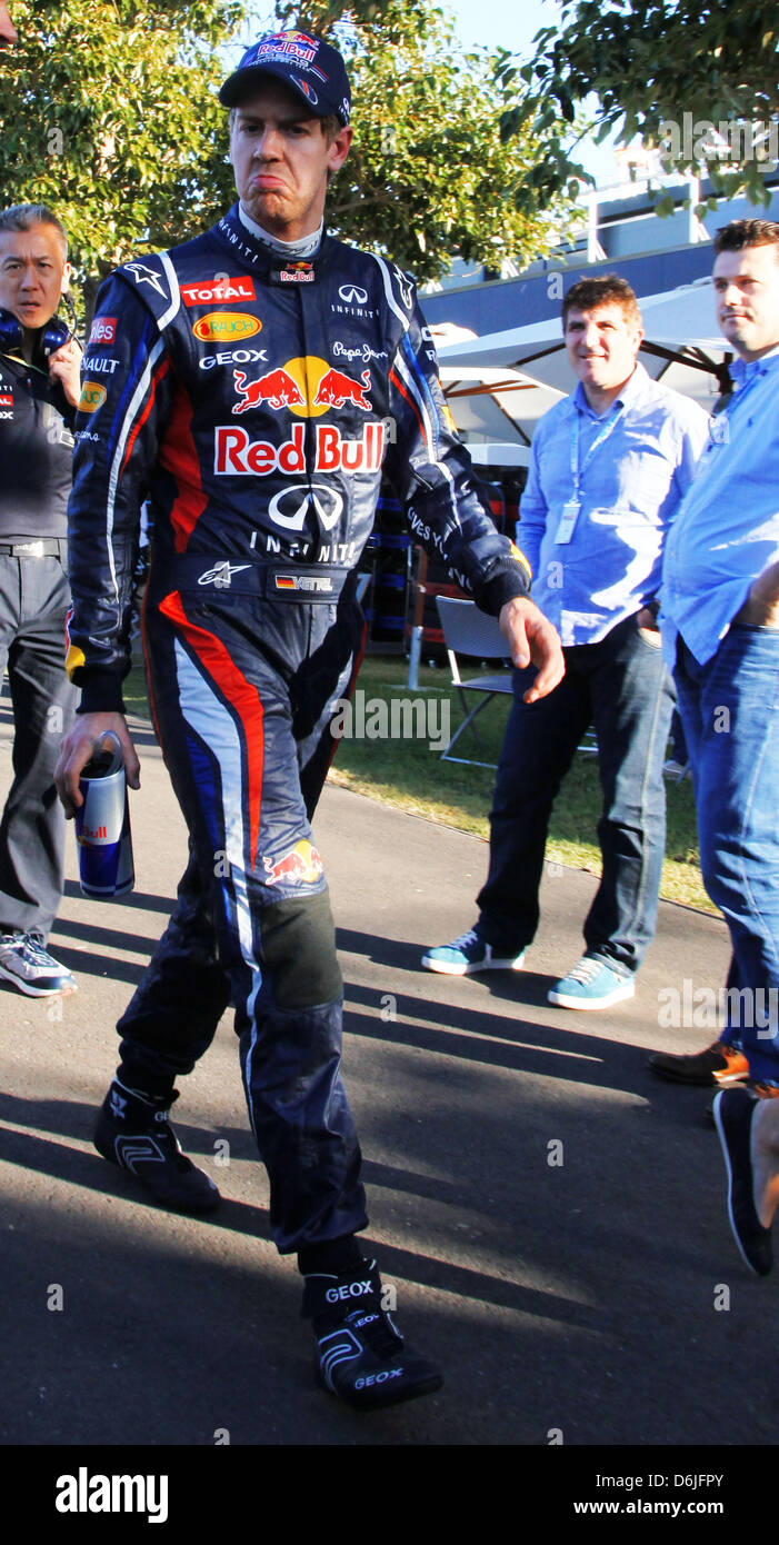 German Formula One driver Sebastian Vettel of Red Bull grimaces in the ...