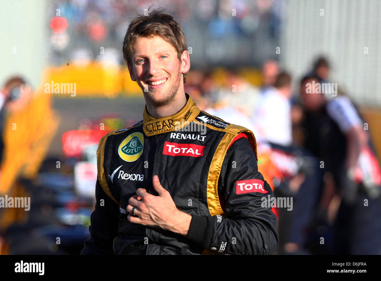 French Formula One driver Romain Grosjean of Lotus reacts after he ...