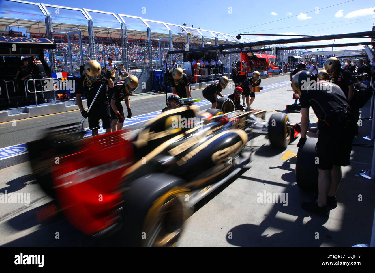French Formula One driver Romain Grosjean of Lotus steers his car in ...