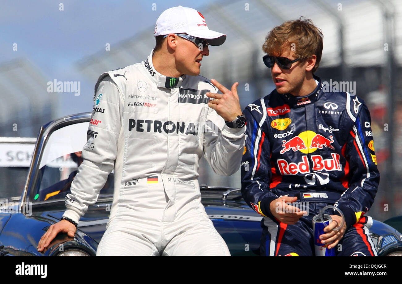German Formula One driver Sebastian Vettel (R) of Red Bull and German ...
