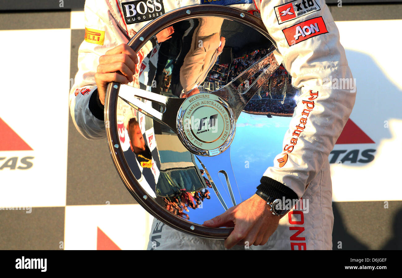 British Formula One driver Jenson Button of McLaren Mercedes holds the ...
