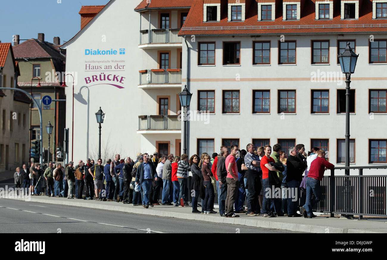 Spectators follow the flight of a model of the legendary Colditz glider ...