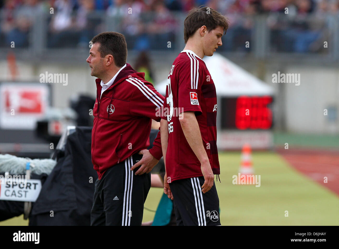 Nuremberg's Philipp Wollscheid (R) is substituted by coach Dieter ...