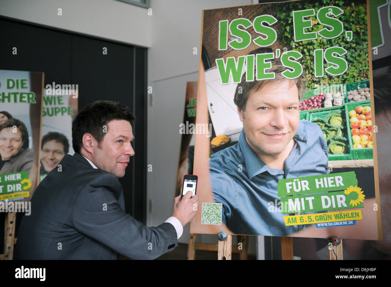 Green top candidate Robert Habeck unveils an election campaign poster ...