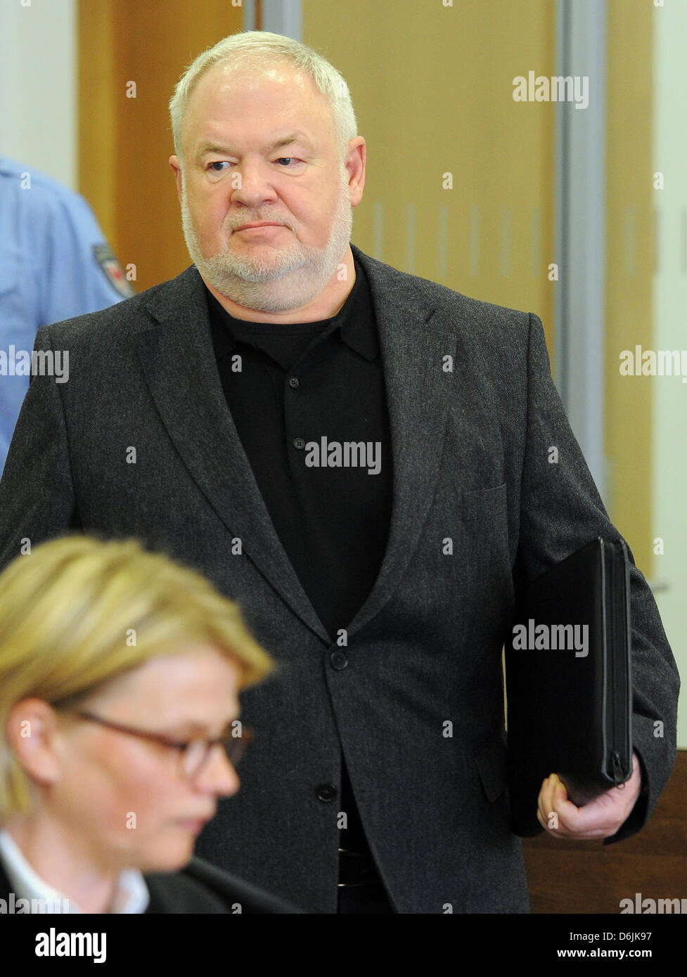 Hotelier Axel Hilpert enters the courtroom for his hearing in Potsdam ...
