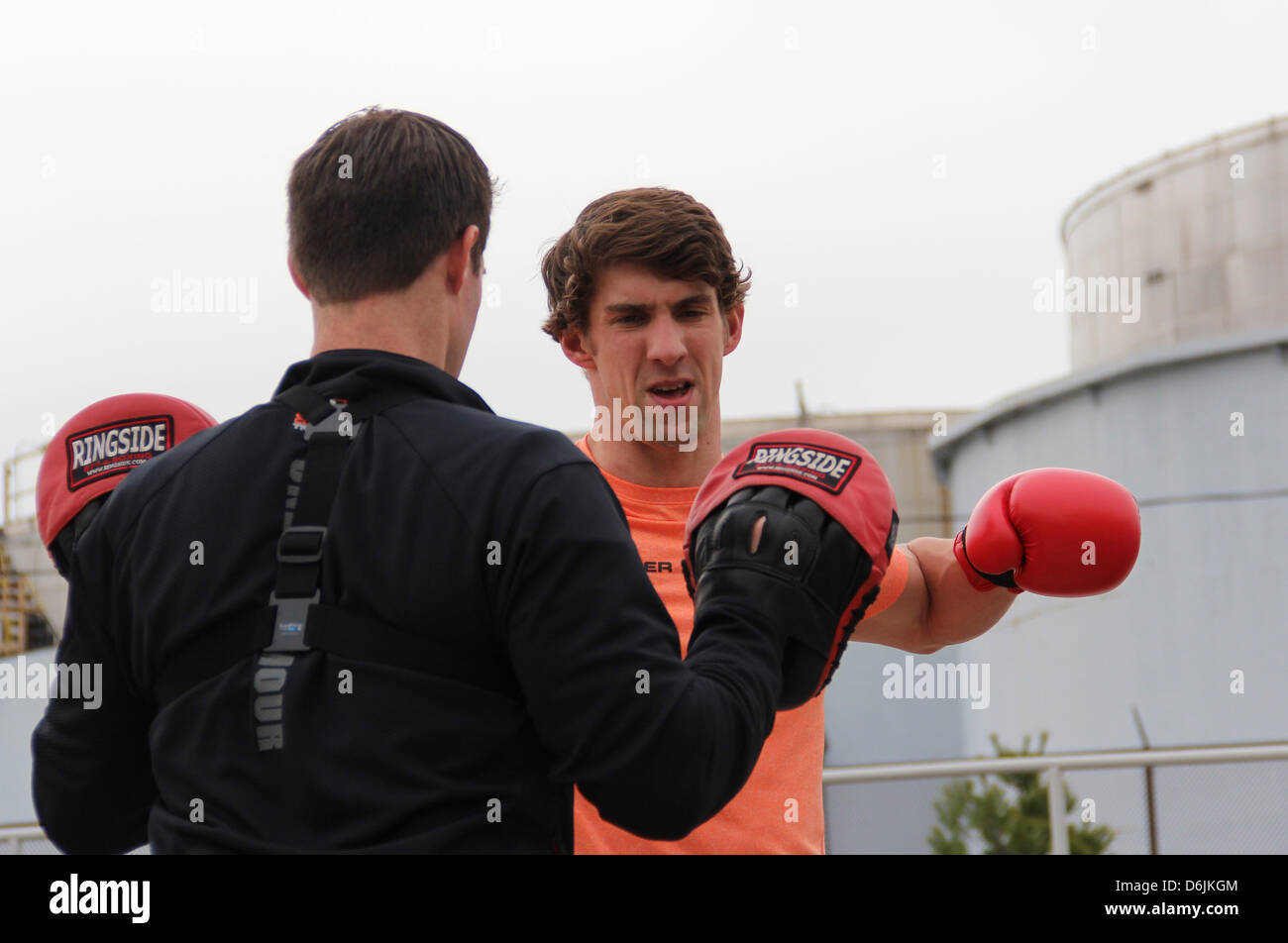 US American swimmer Michael Phelps (R) boxers with his trainer Kennan ...