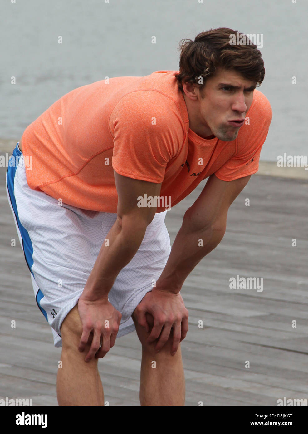 US American swimmer Michael Phelps stands exhausted during a press ...