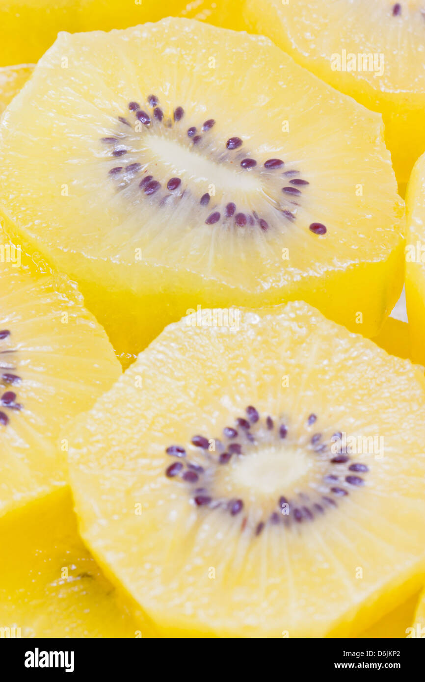 Full frame of yellow kiwi fruit sliced Stock Photo - Alamy