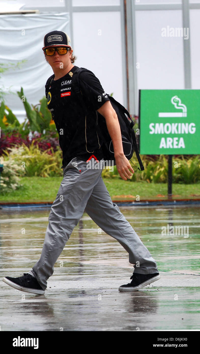 Finnish Formula One driver Kimi Raikkonen of Lotus arrives the paddock ...