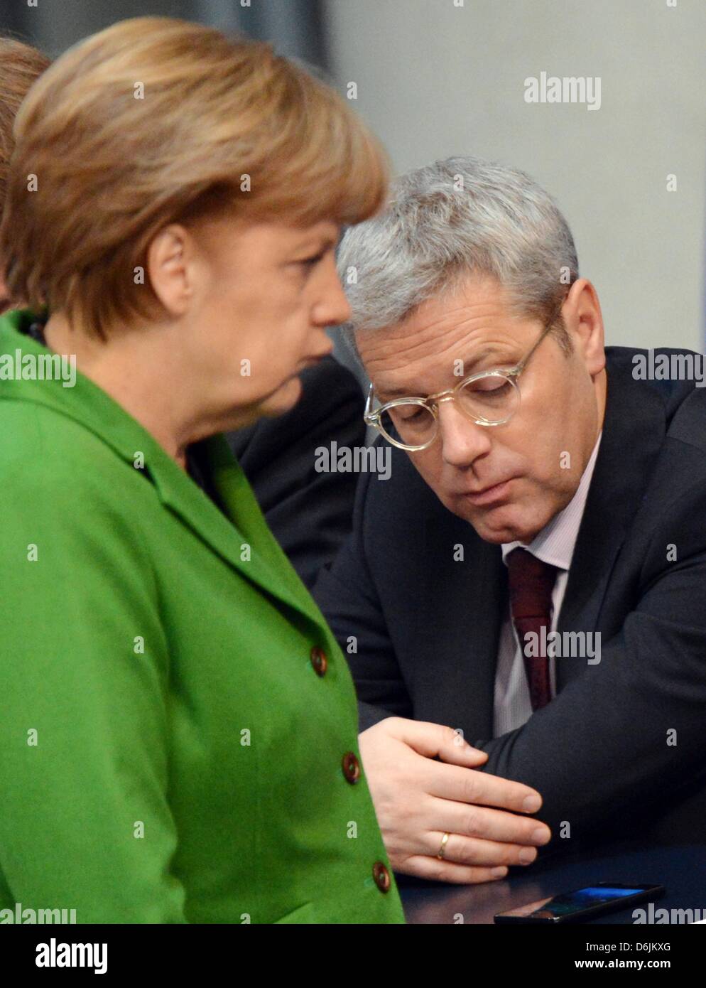 German Chancellor Angela Merkel walks past German Minister for ...