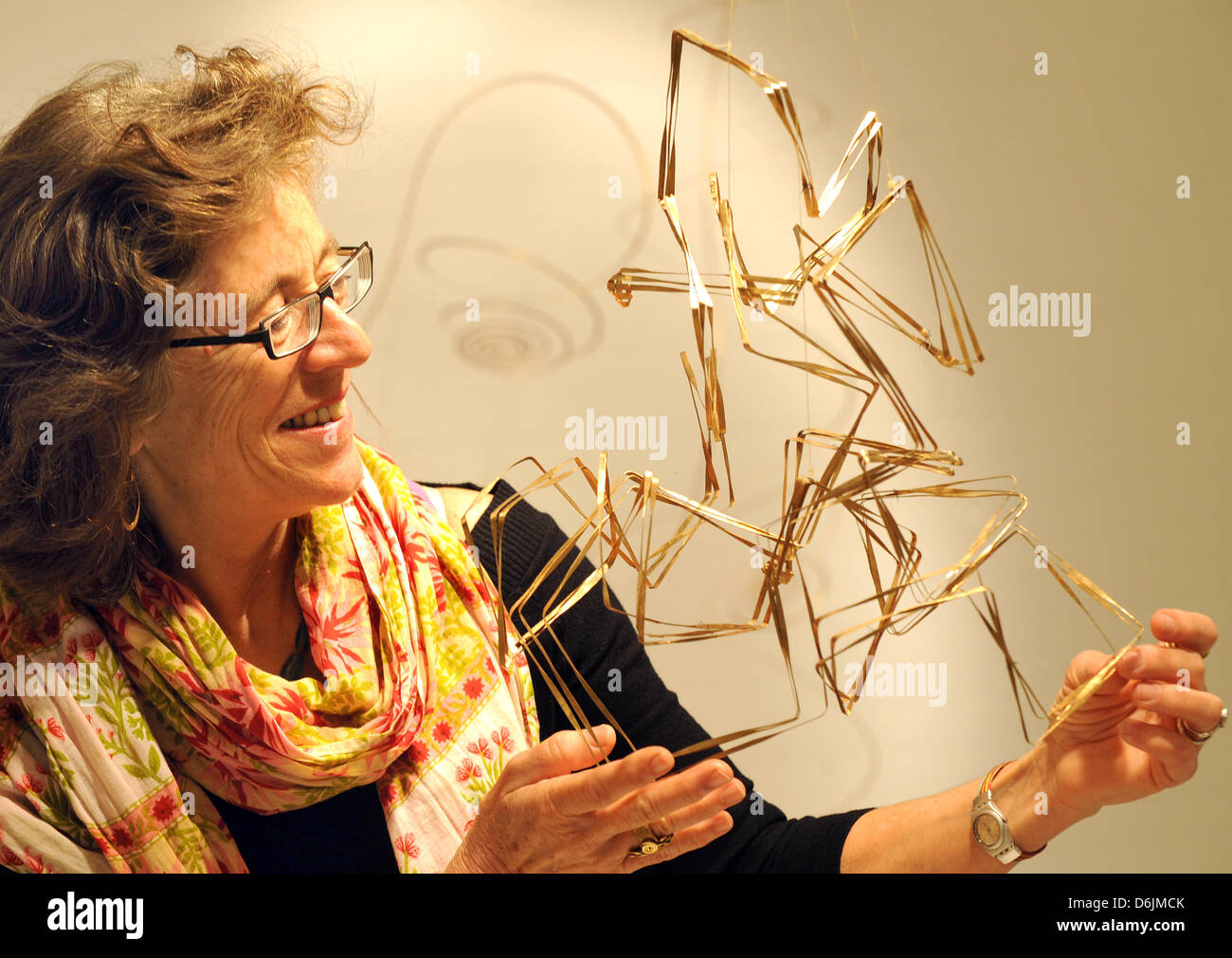 Greek artist Corinna Coutouzi presents one of her bronze sculptures at ...
