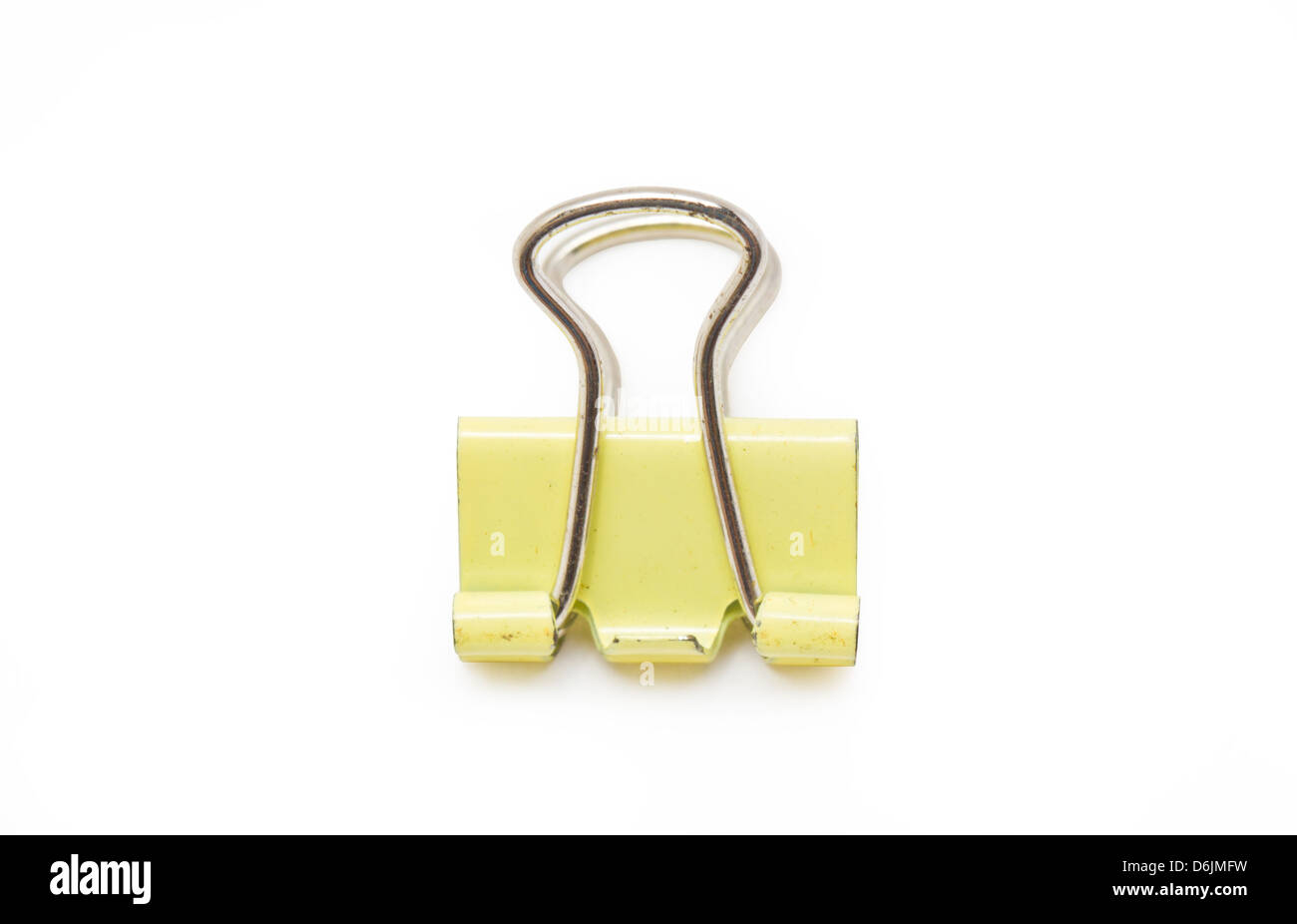 Yellow metal paper clip isolated on white background Stock Photo - Alamy
