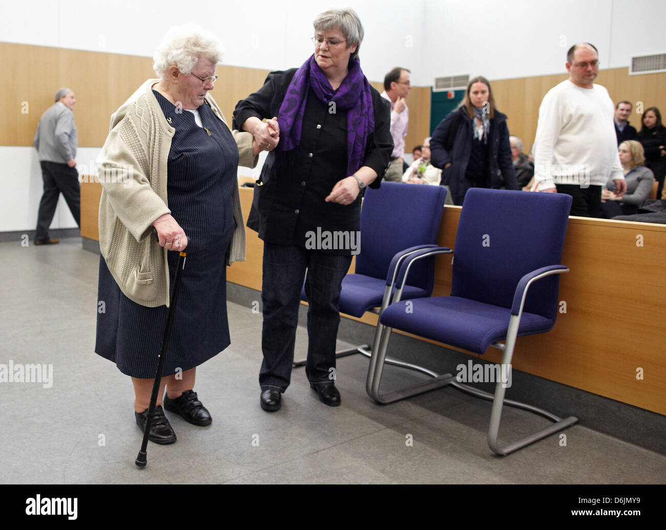 83 year old Hildegard Brieger (L) helped to her place by her daughter ...