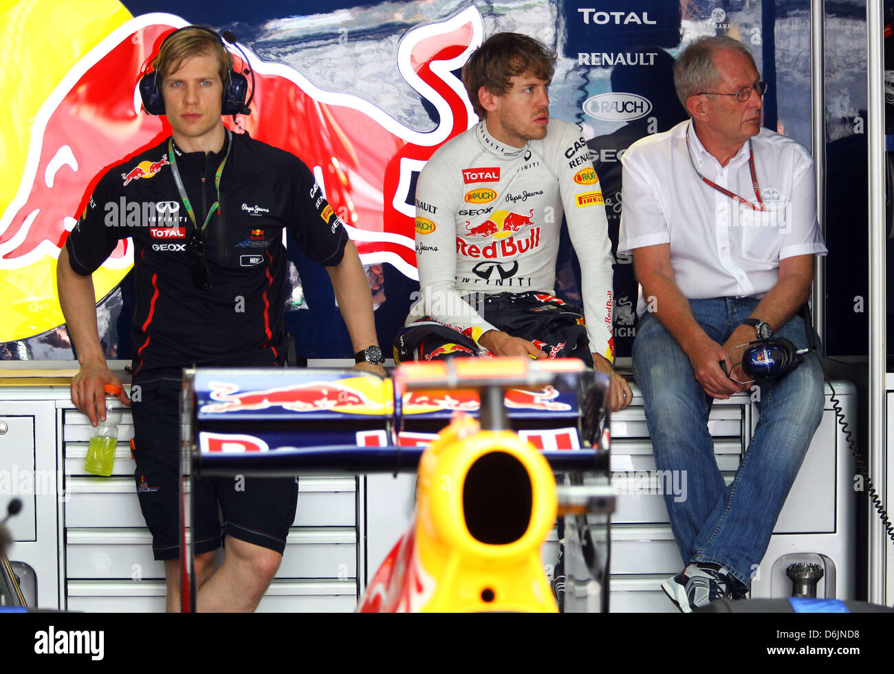 German Formula One driver Sebastian Vettel (C) of Red Bull, the chief ...