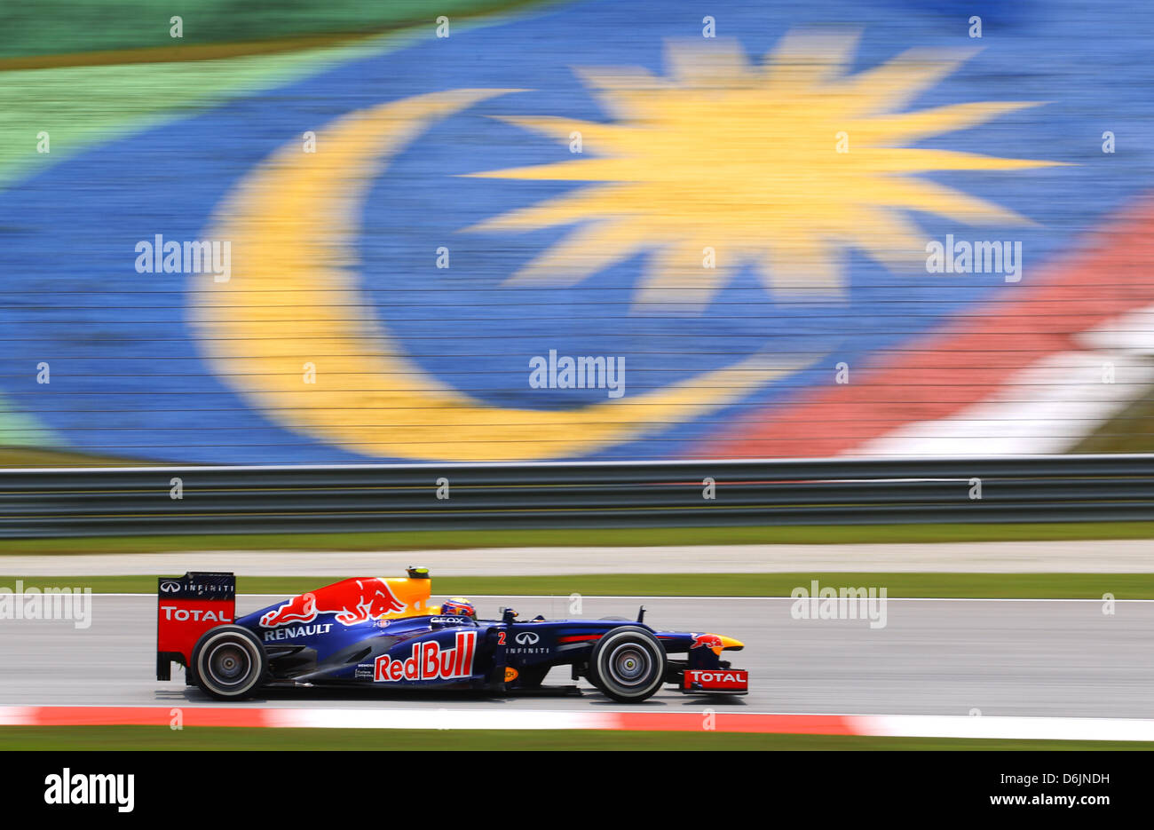 German Formula One driver Sebastian Vettel of Red Bull steers his car ...