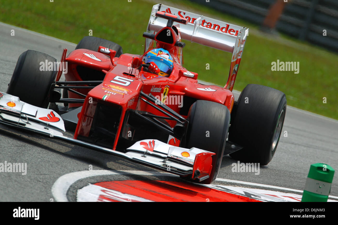 Spanish Formula One driver Fernando Alonso of Ferrari steers his car ...