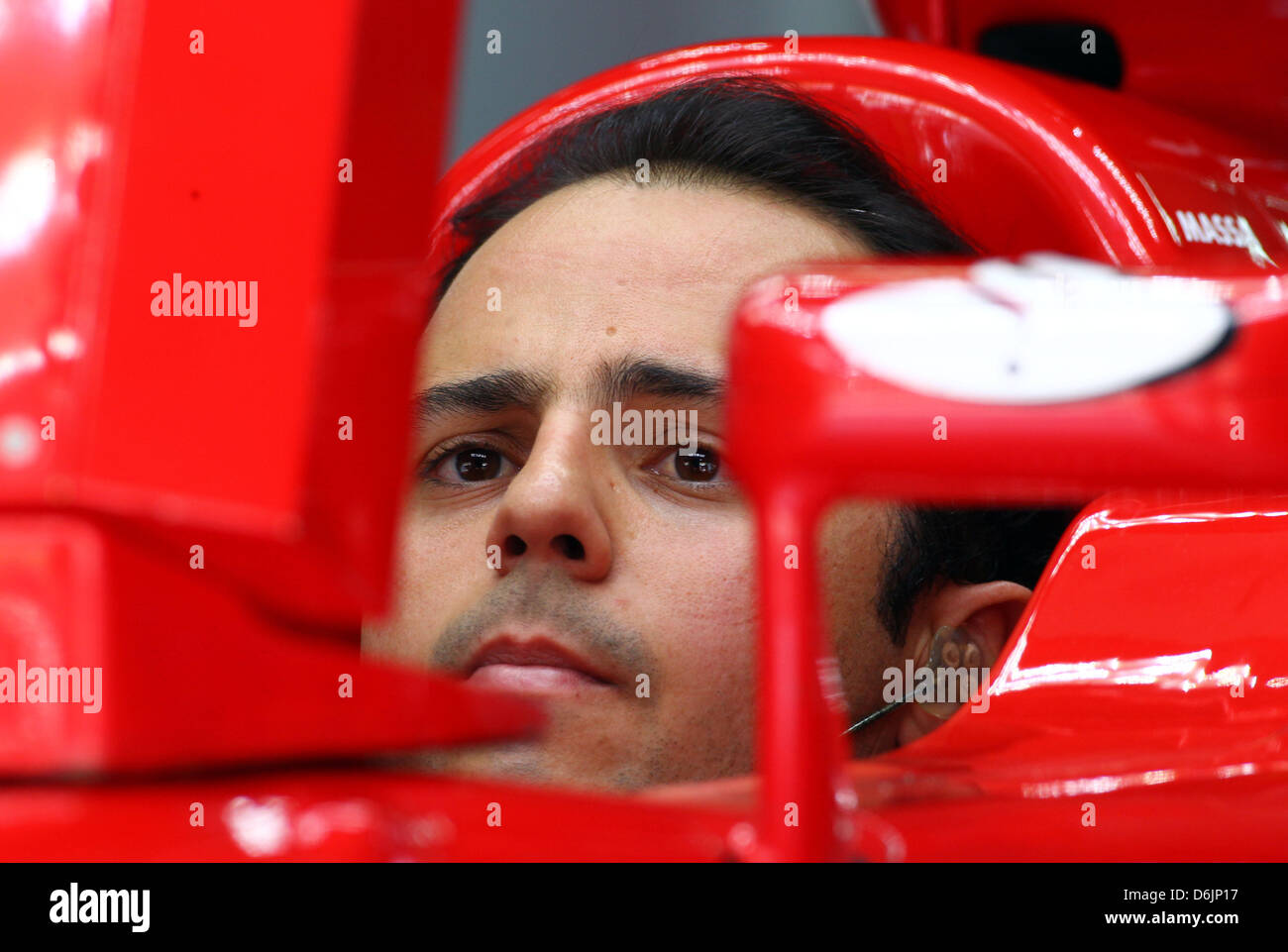 Brazilian Formula One driver Felipe Massa of Ferrari sits in his car ...