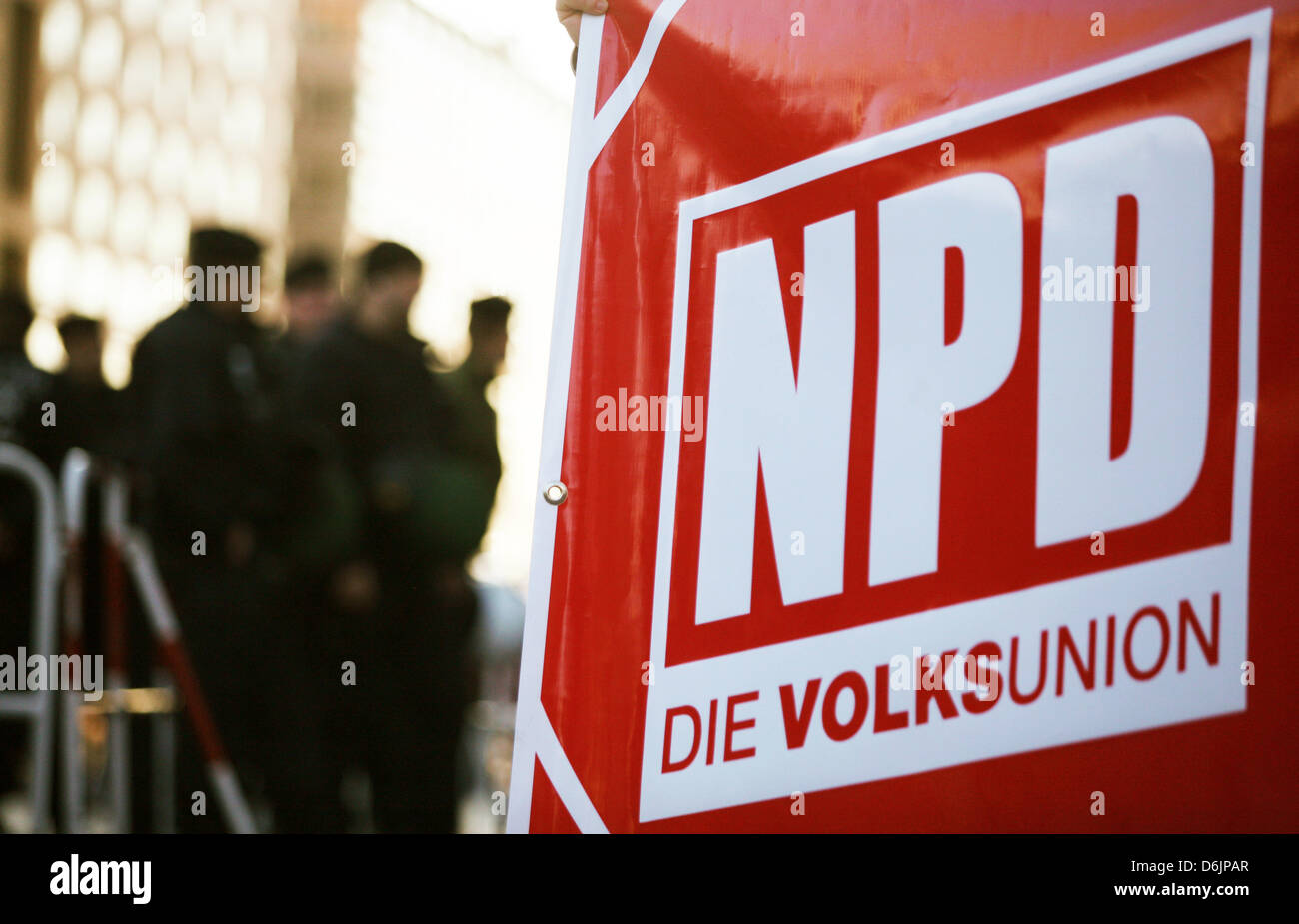 Police officers stand during a solemn vigil of the far right party NPD ...