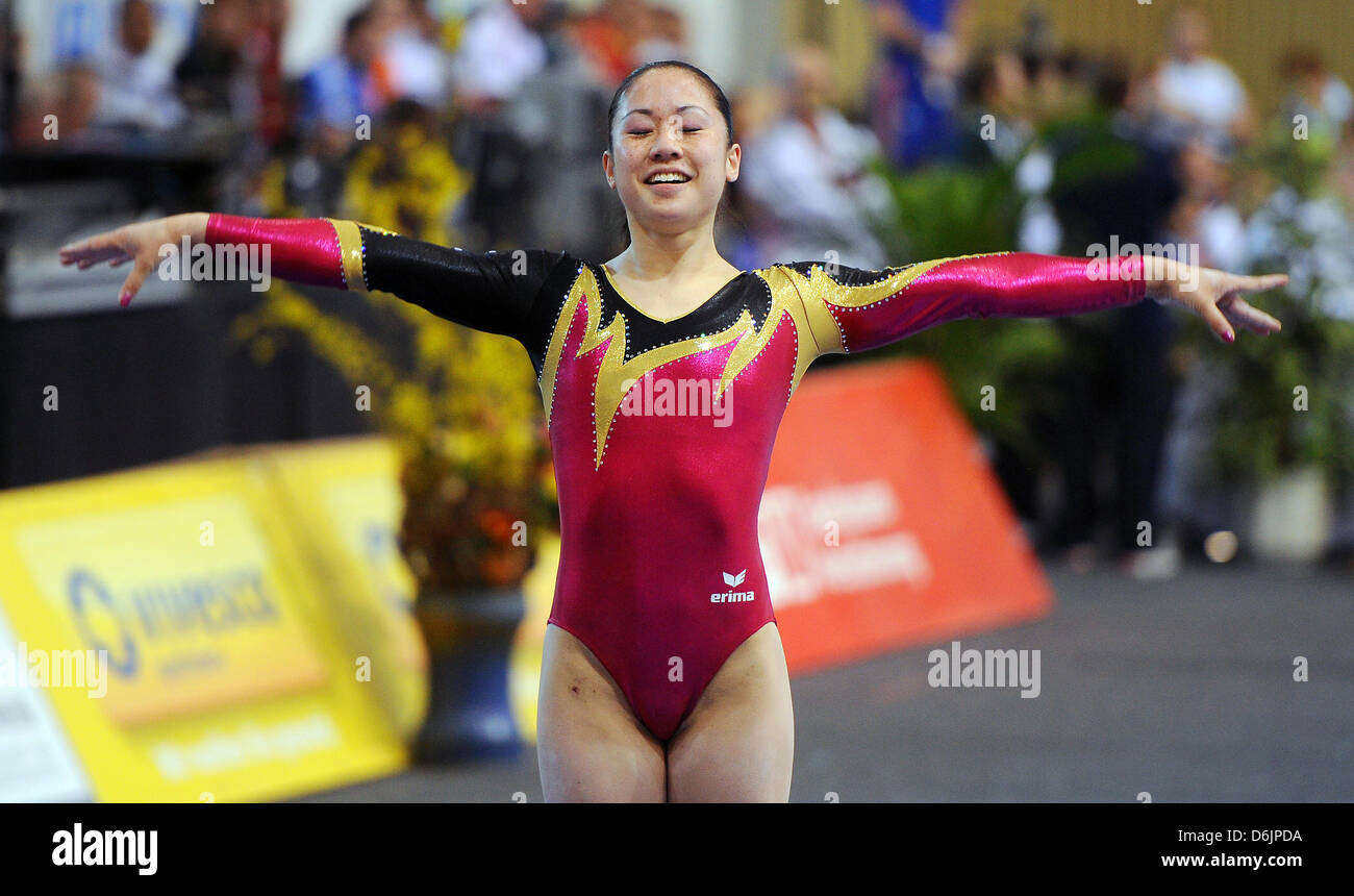 German gymnast Kim Bui smiles after her performance on the balance beam ...