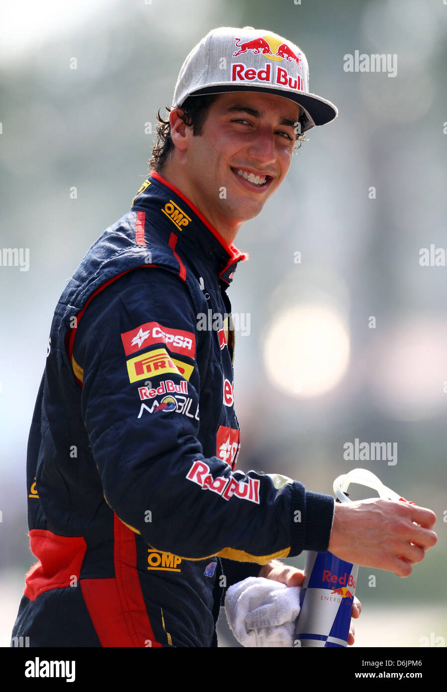 Australian Formula One driver Daniel Ricciardo of Toro Rosso walks ...