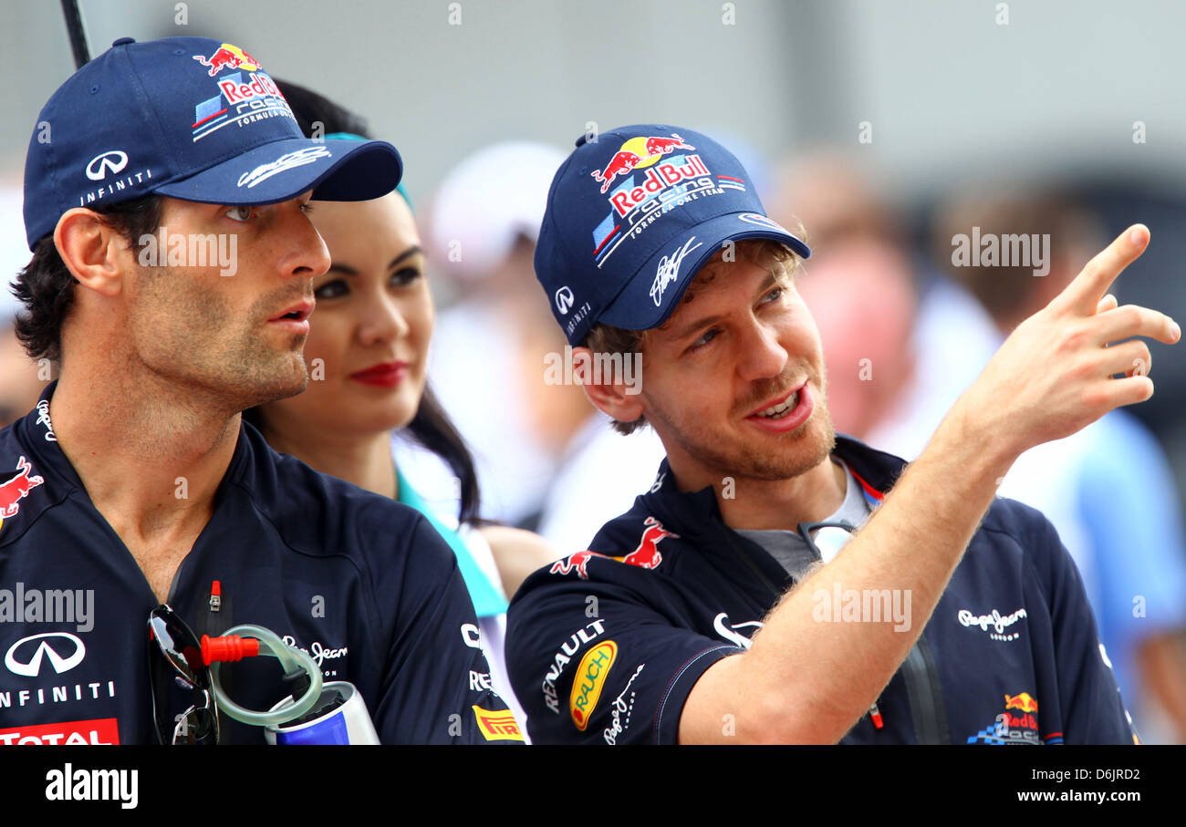 German Formula One driver Sebastian Vettel (R) and Australian Formula ...