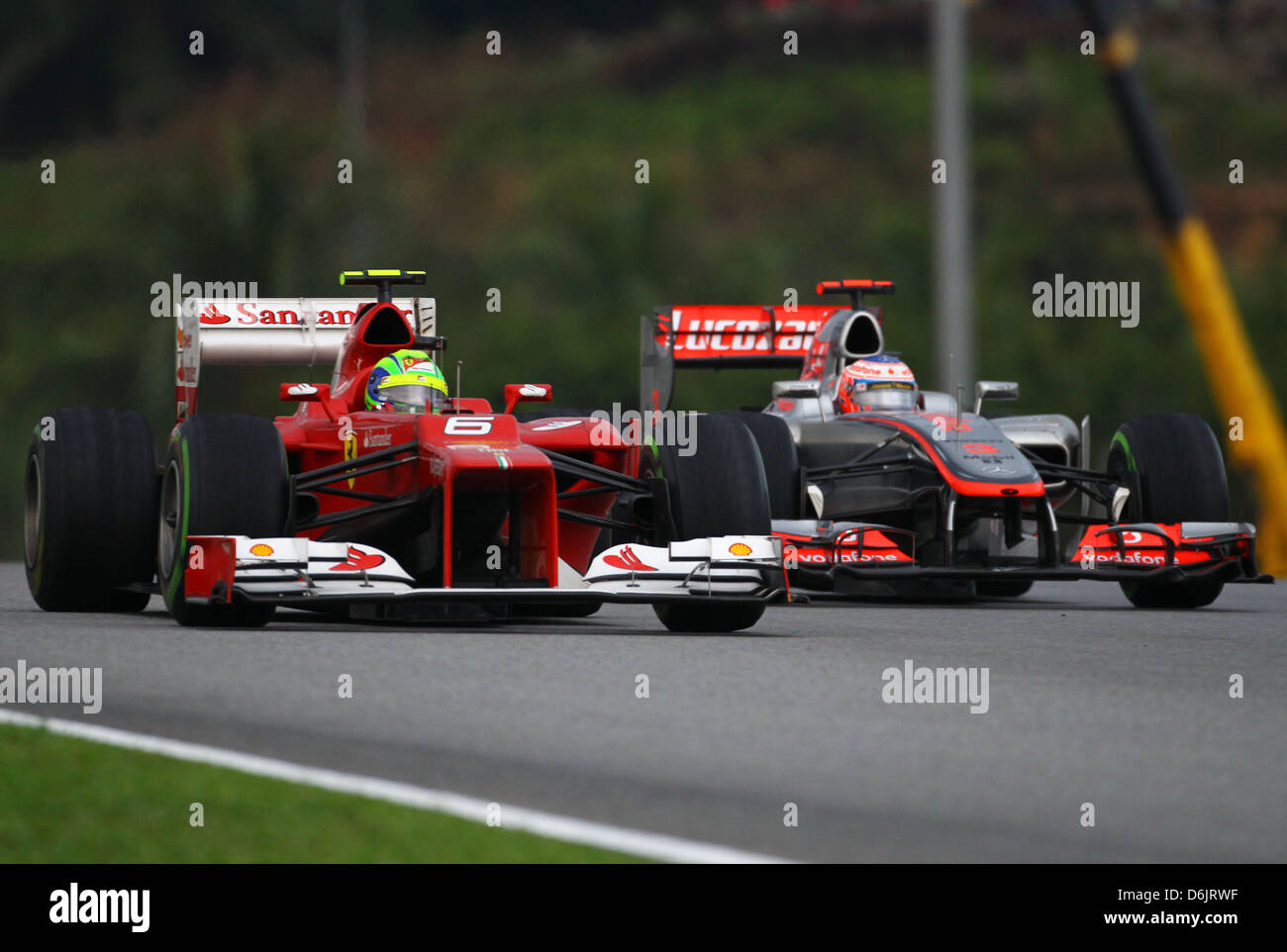 Brazilian Formula One driver Felipe Massa (L) of Ferrari and British ...