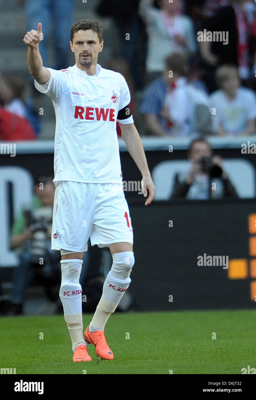 Cologne's Milivoje Novakovic celebrates his 1-0 goal during the German ...