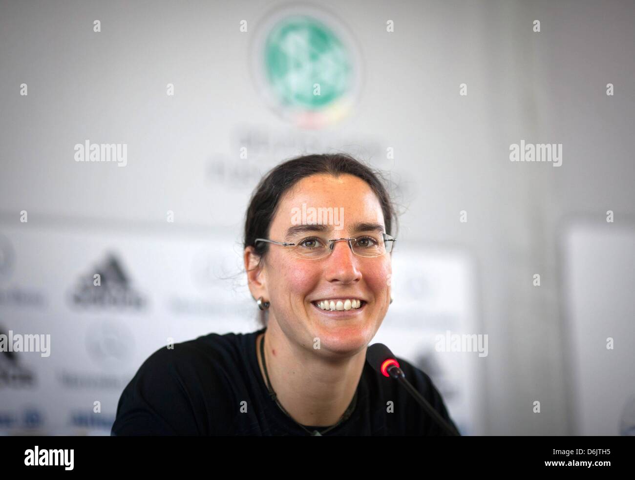 Record national soccer player Birgit Prinz (L) smiles during the press ...