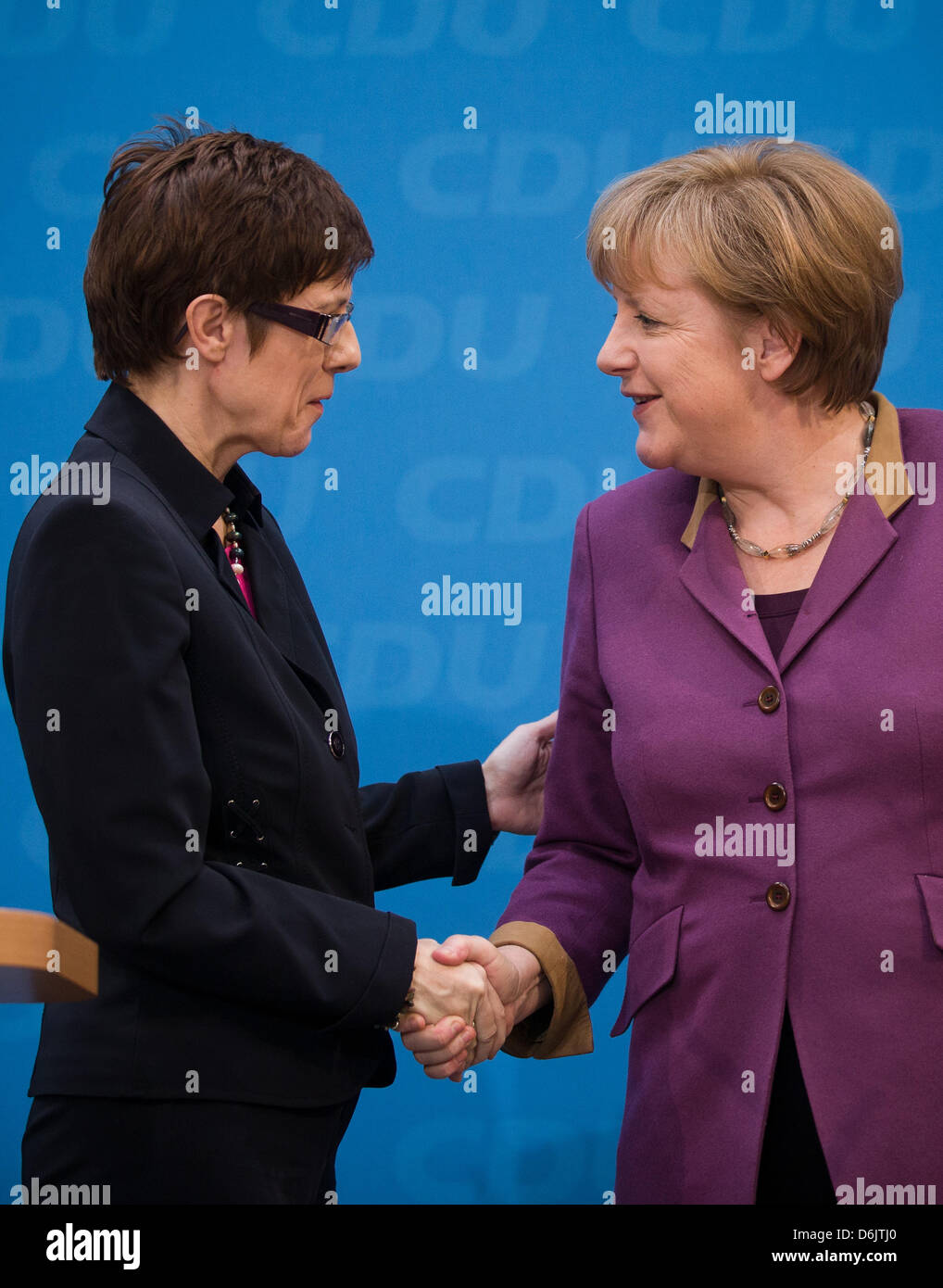 German Chancellor and CDU federal chairwoman Angela Merkel shakes hands ...