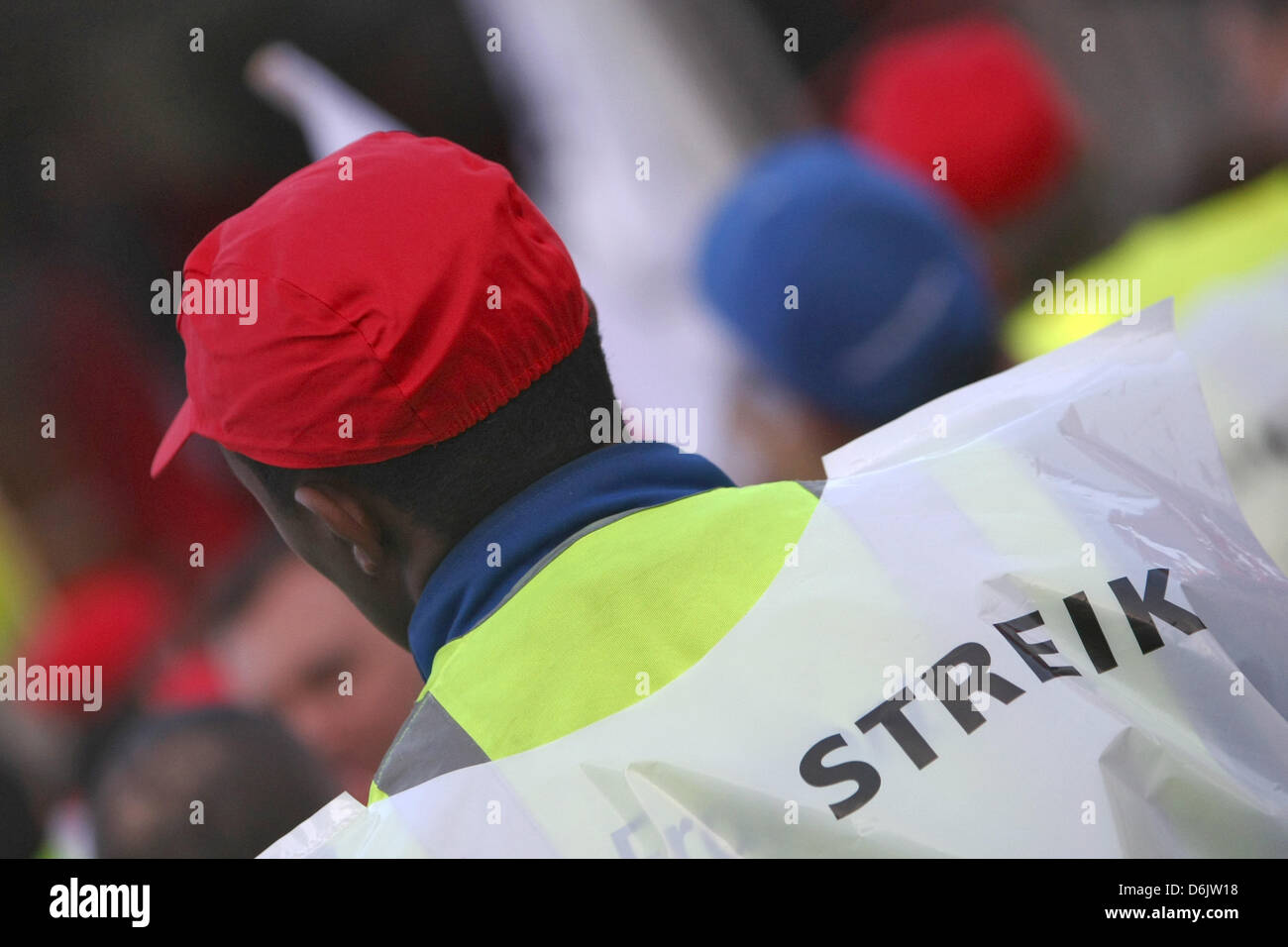 A striking man wears a 'Strike' shirt during a warning strike at ...