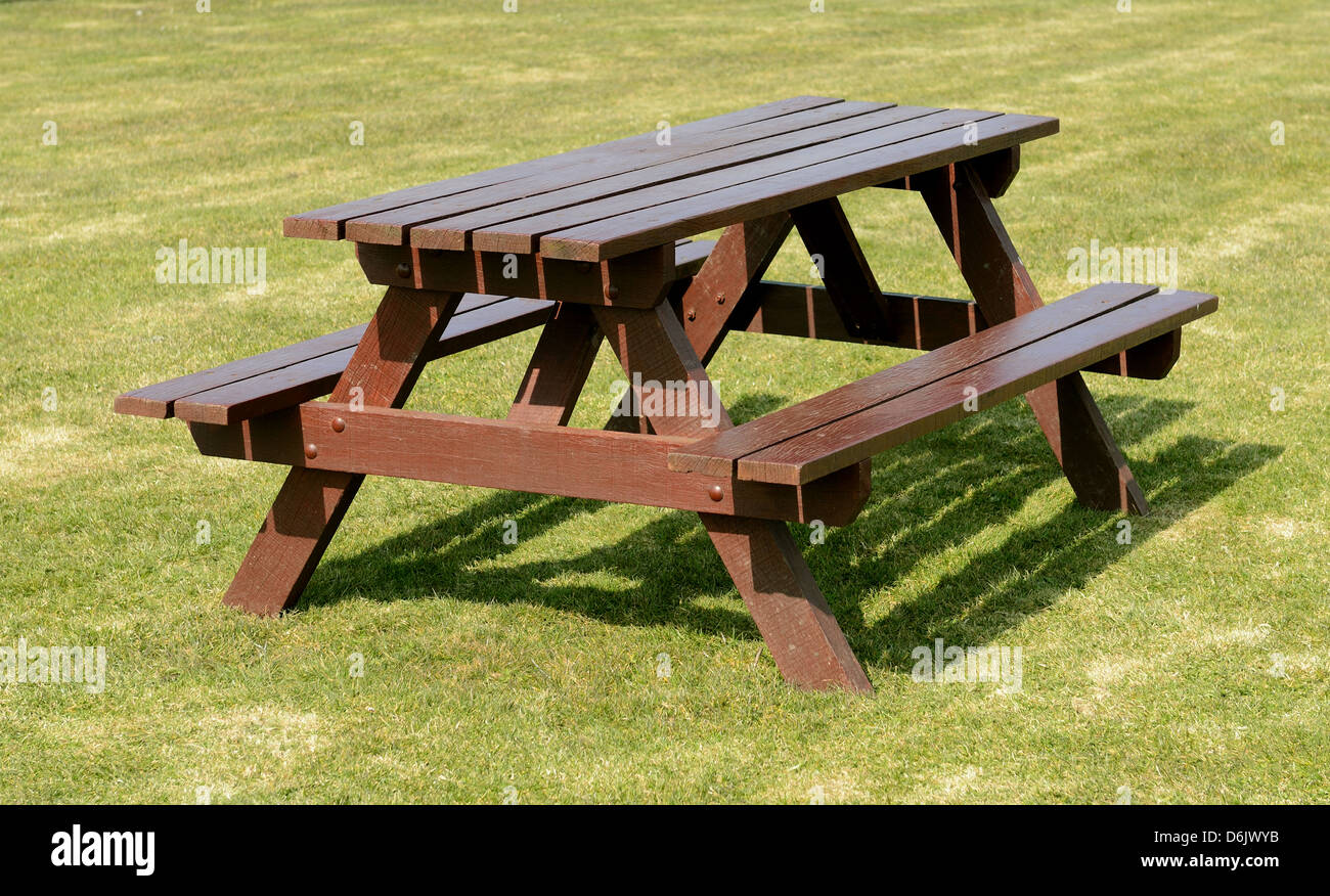 A park picnic table isolated on green grass background Stock Photo - Alamy