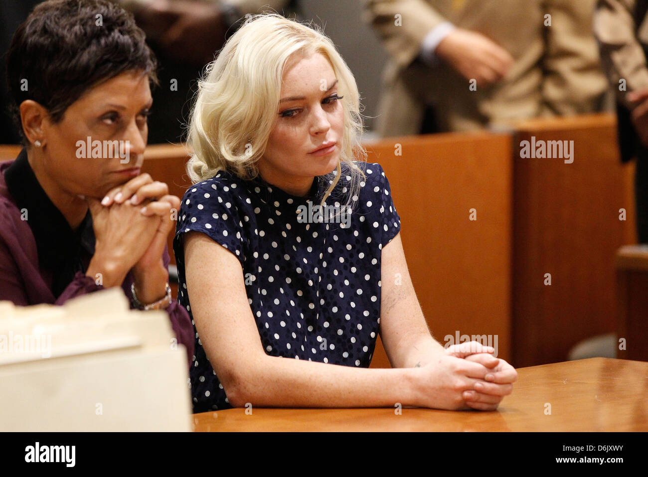 Lawyer Shawn Chapman Holley and Lindsay Lohan inside the Los Angeles ...