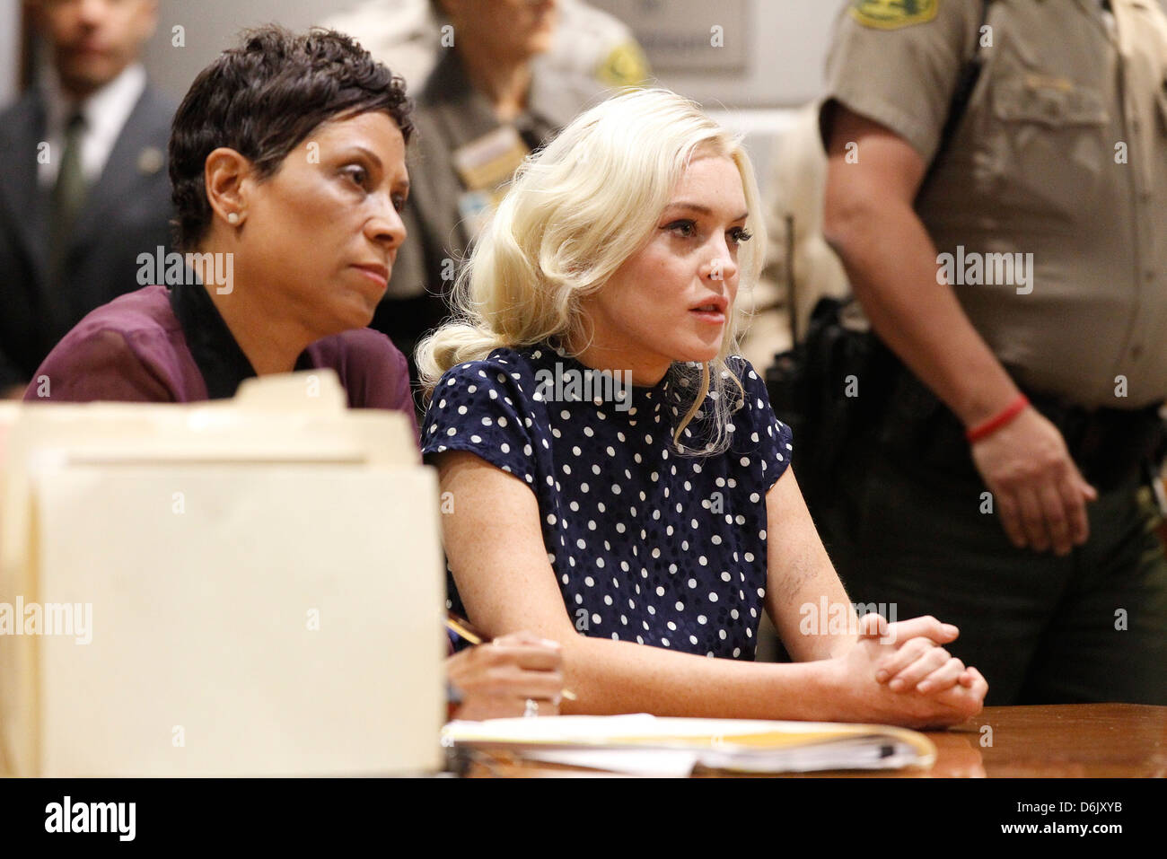 Lawyer Shawn Chapman Holley and Lindsay Lohan inside the Los Angeles ...