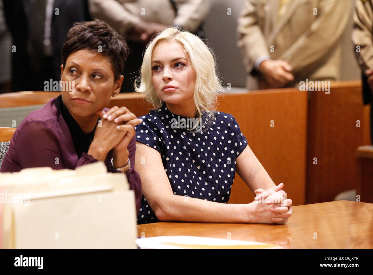 Lawyer Shawn Chapman Holley and Lindsay Lohan inside the Los Angeles ...