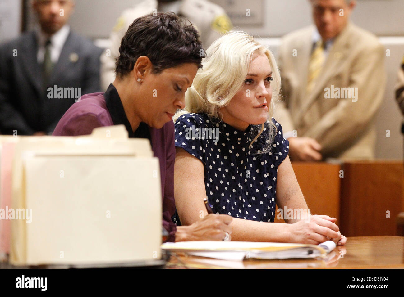 Lawyer Shawn Chapman Holley and Lindsay Lohan inside the Los Angeles ...