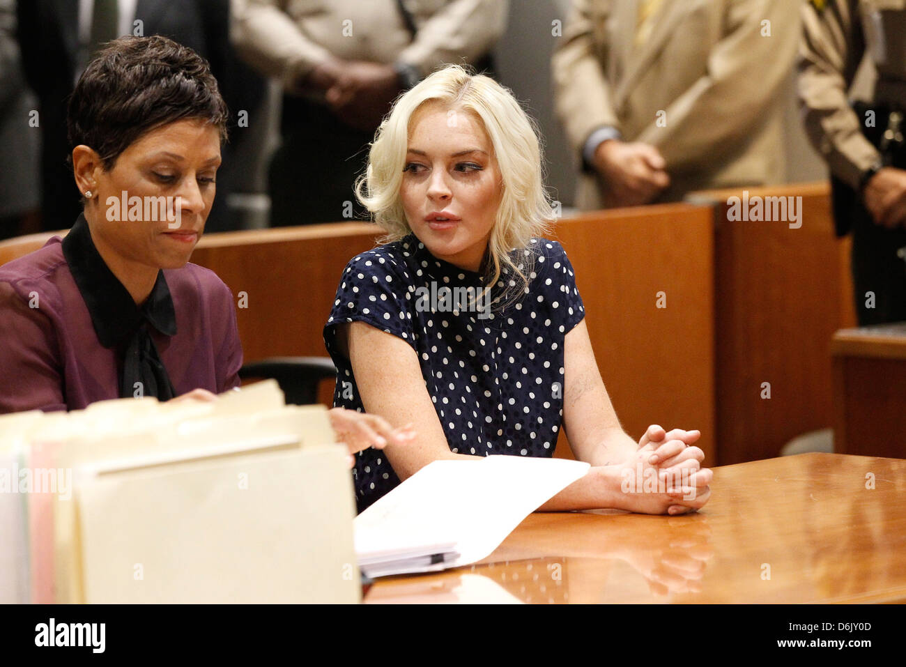 Lawyer Shawn Chapman Holley and Lindsay Lohan inside the Los Angeles ...